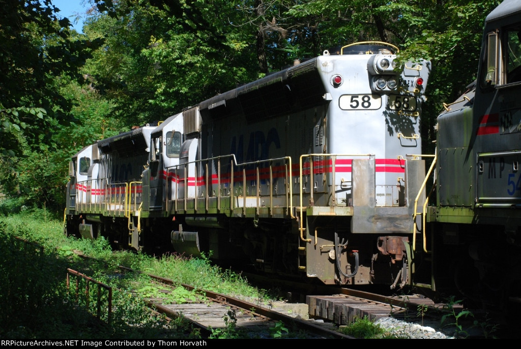 MPEX 58 sits idle on a side track, its fate unknown